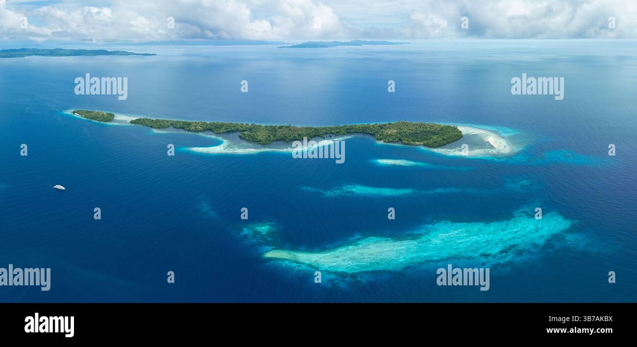 Healthy coral reefs fringe the idyllic islands of Garacie, near ...