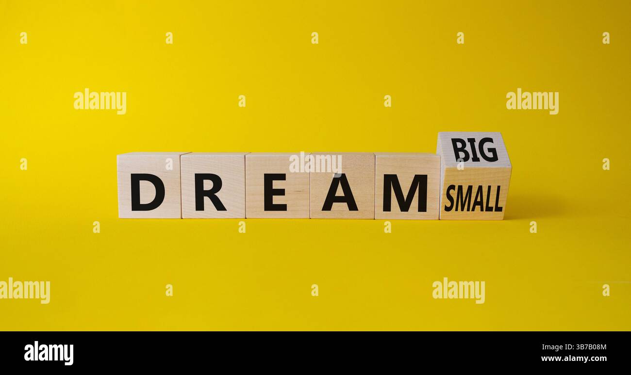 Dream Big vs Small symbol. Wooden cubes with words Dream Small and ...