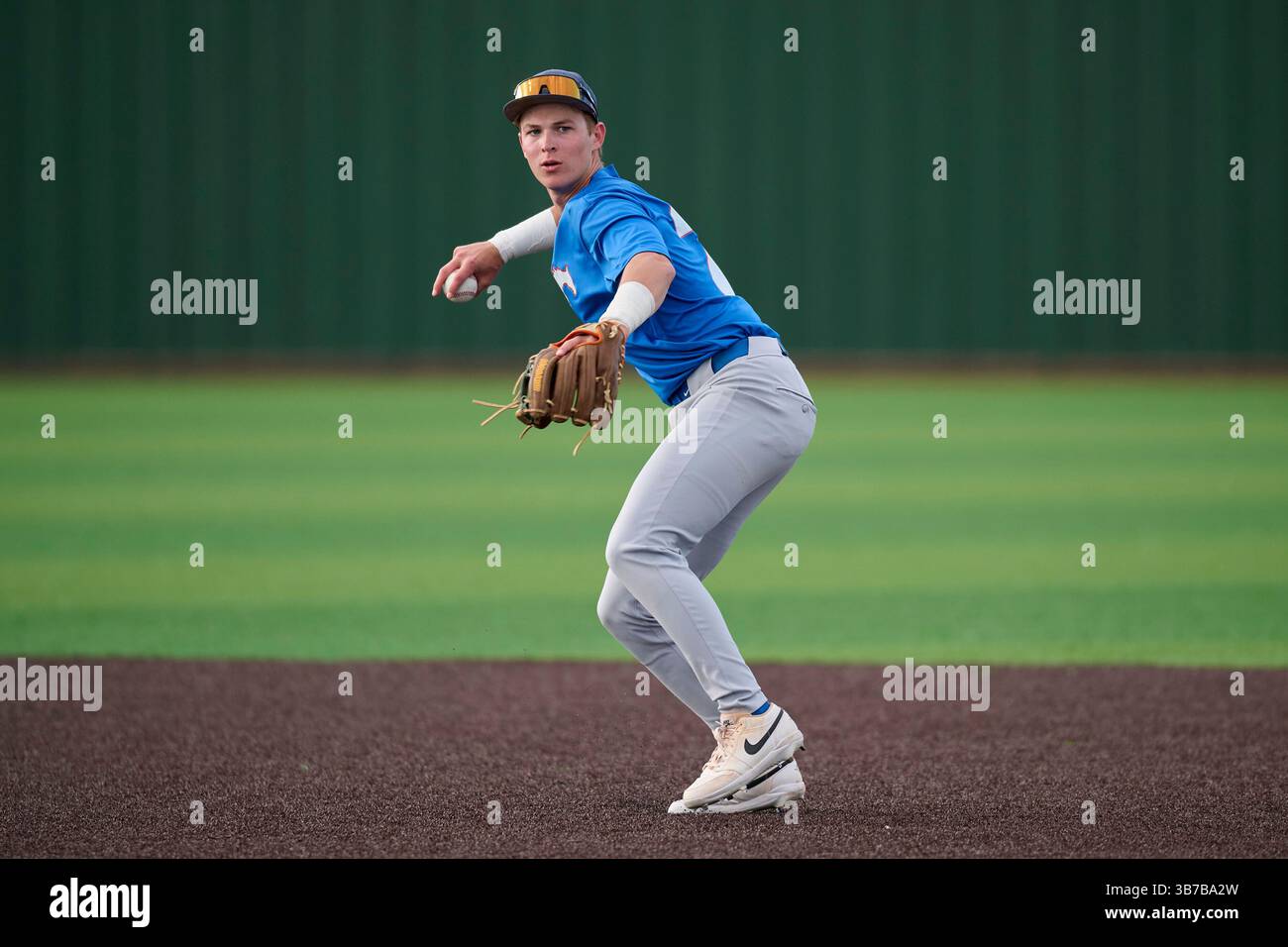 Fort Cobb-Broxton Mustangs shortstop Eli Willits (2) throws to first base during a High School ...