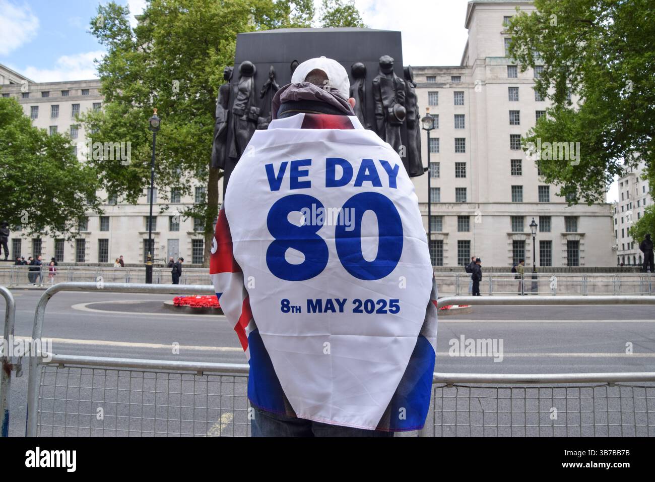 London, UK. 05th May, 2025. A man stands in Whitehall after the VE Day ...