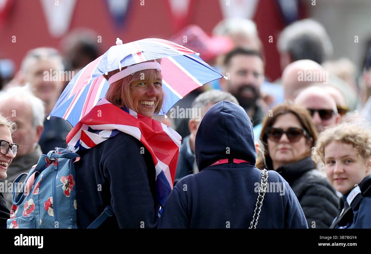 London, Britain. 5th May, 2025. People watch the military procession ...