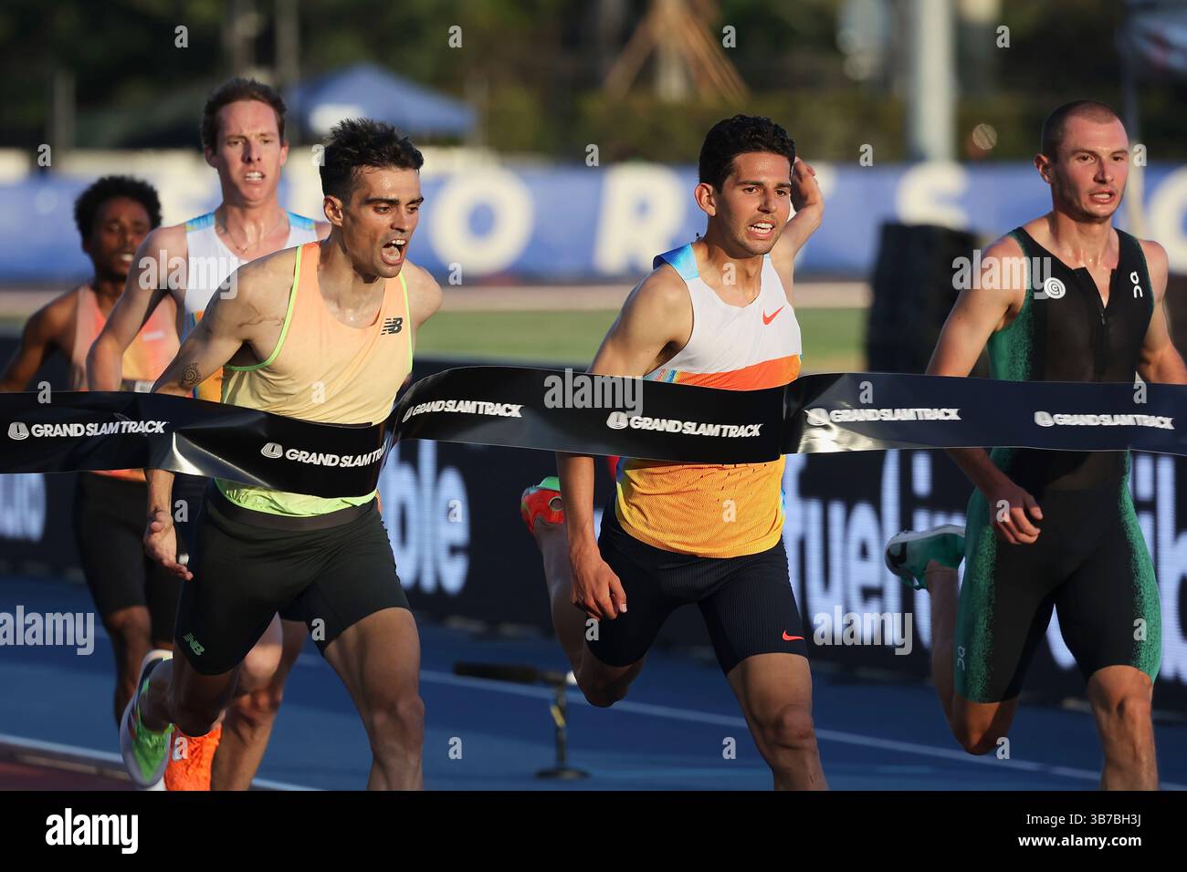 Andrew Coscoran of Ireland (left) edges out Grant Fisher of the USA ...