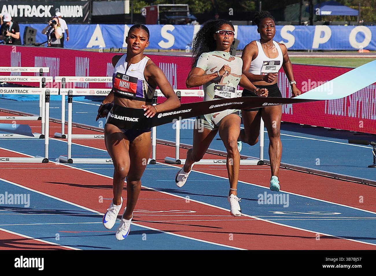 Masai Russell (far left) wins the Women’s 100 meter hurdles in a new ...