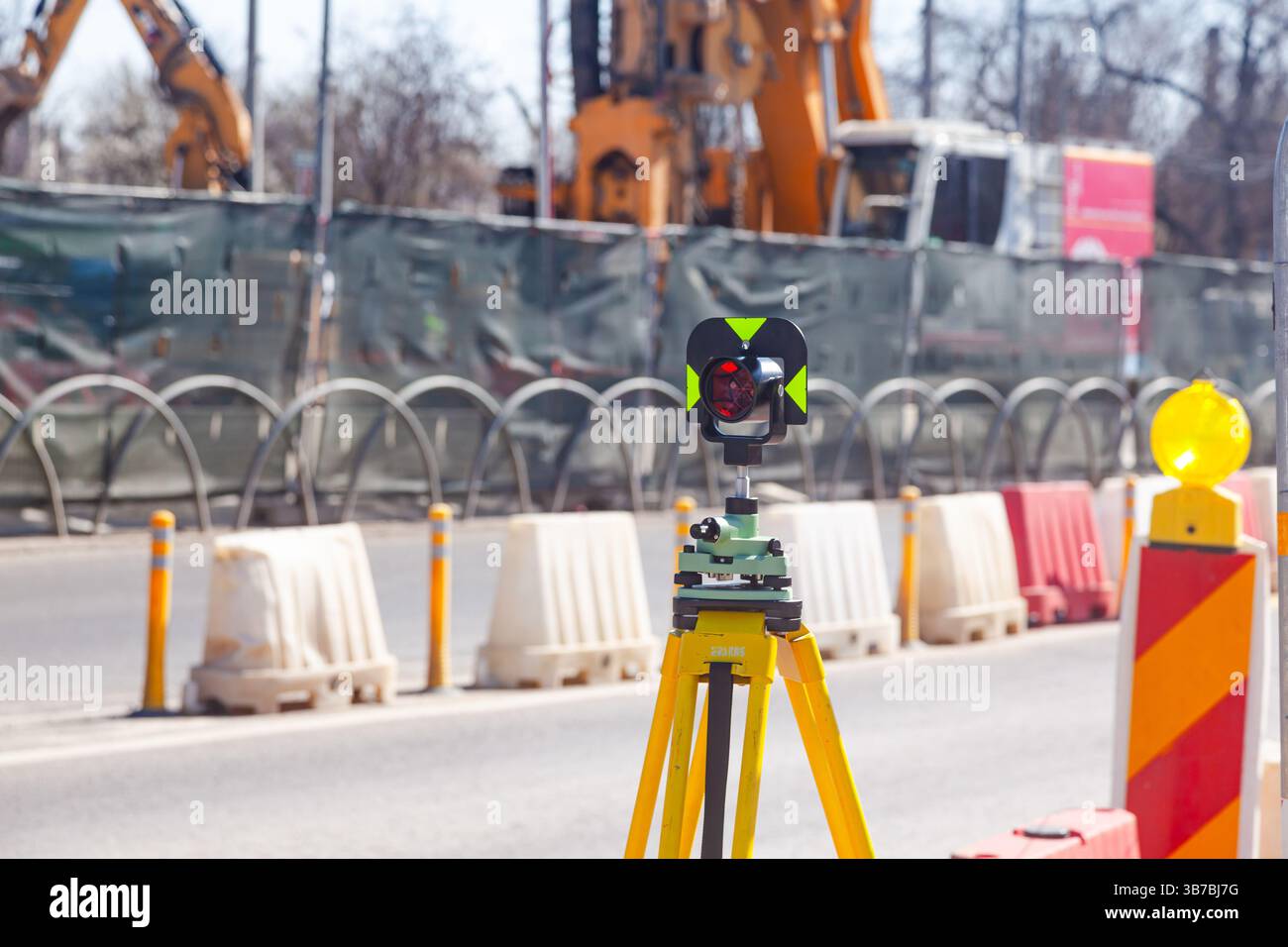 An optical road level stands on a road undergoing repairs Stock Photo ...