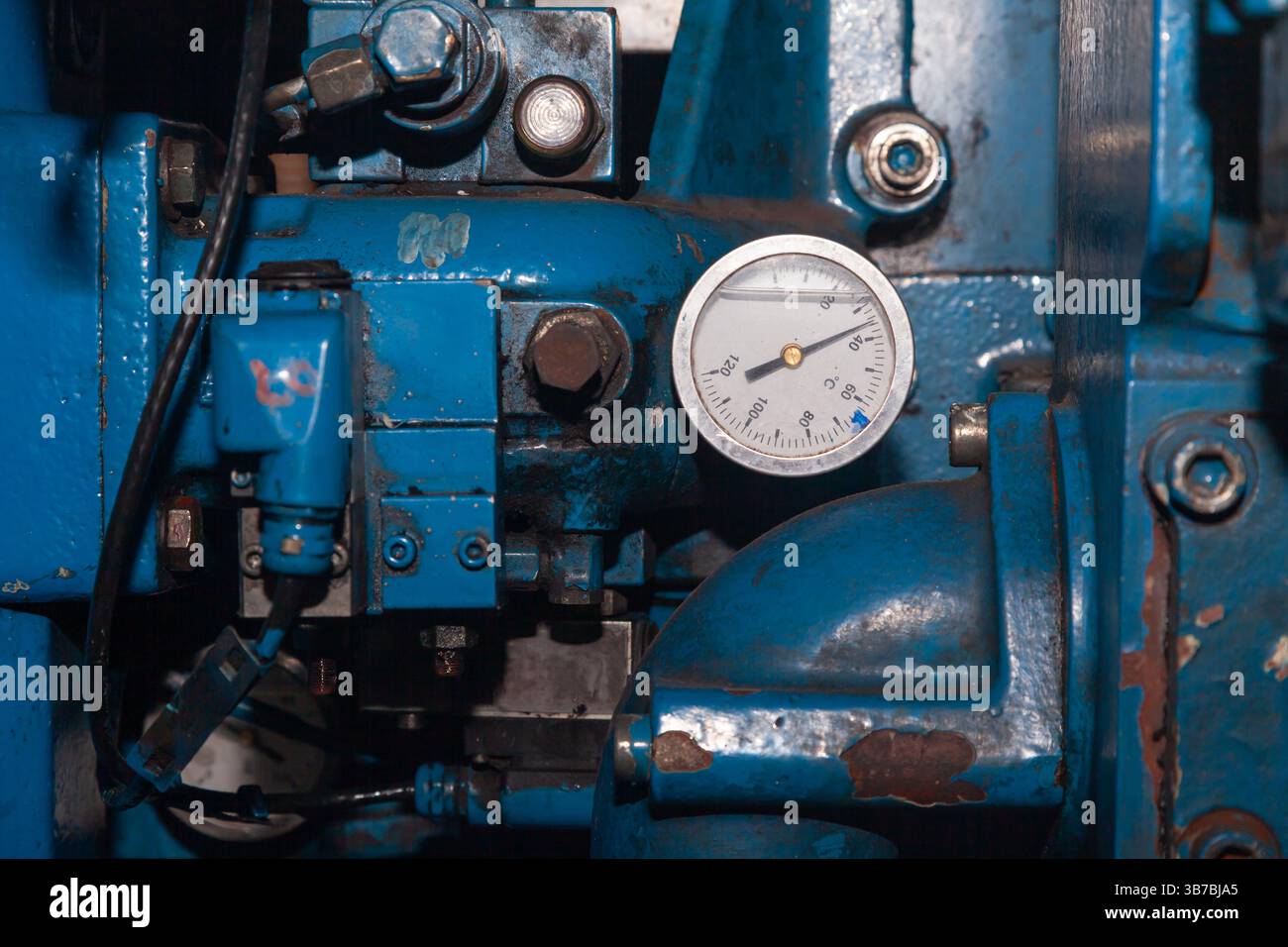Part of a ship's propulsion system with a temperature gauge installed ...