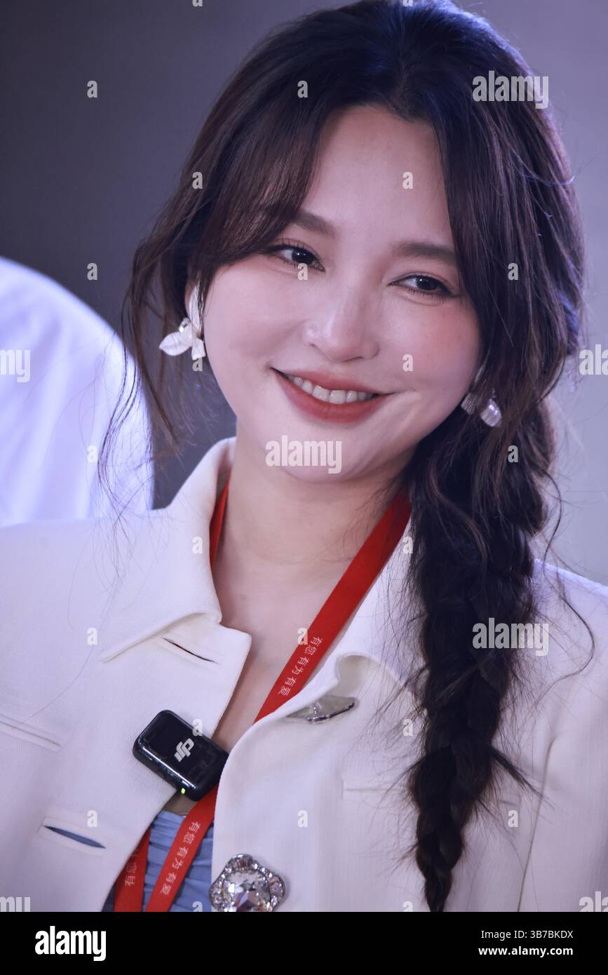 Chinese actress and singer Jin Sha attends an activity in Shanghai ...