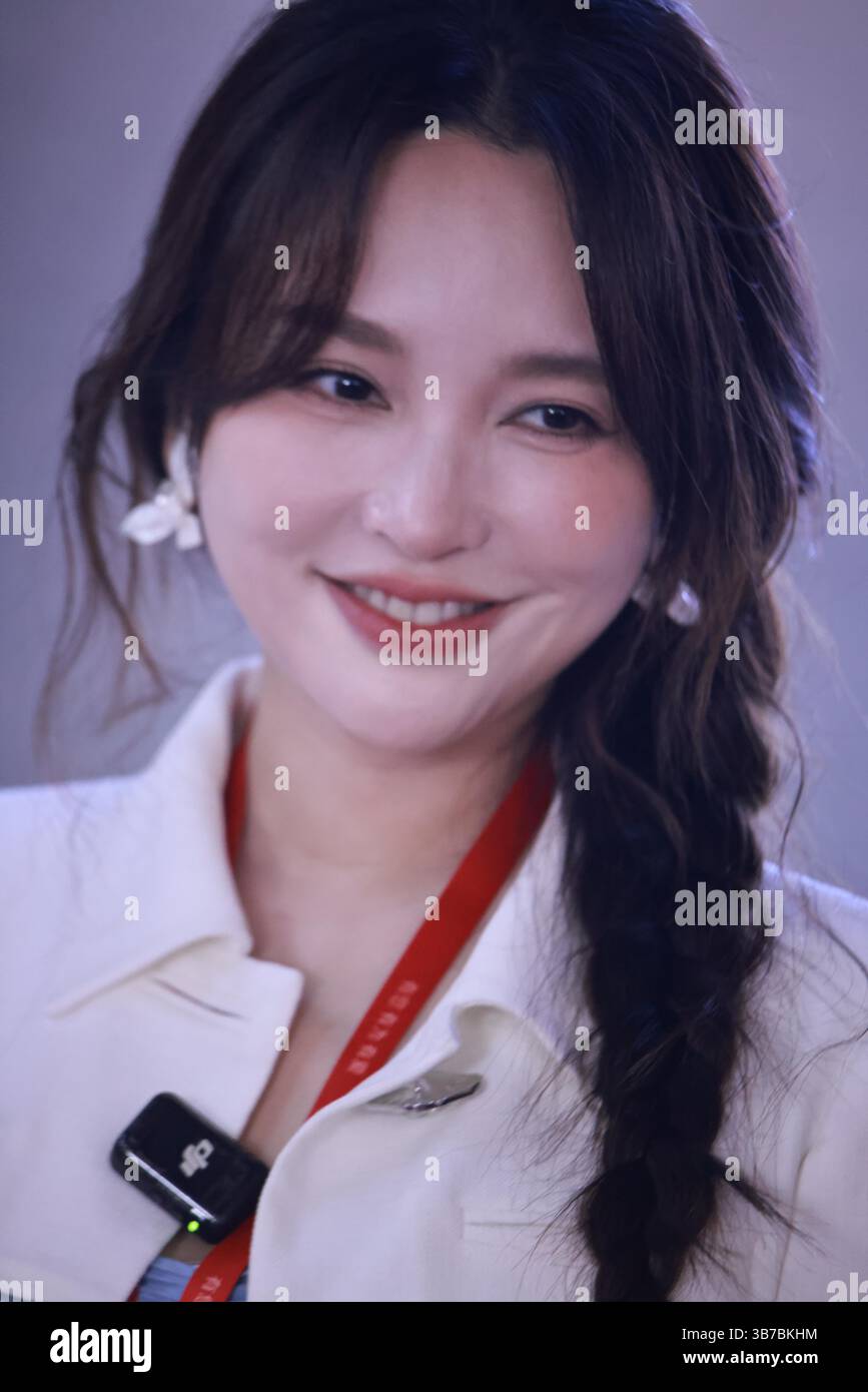 Chinese actress and singer Jin Sha attends an activity in Shanghai ...