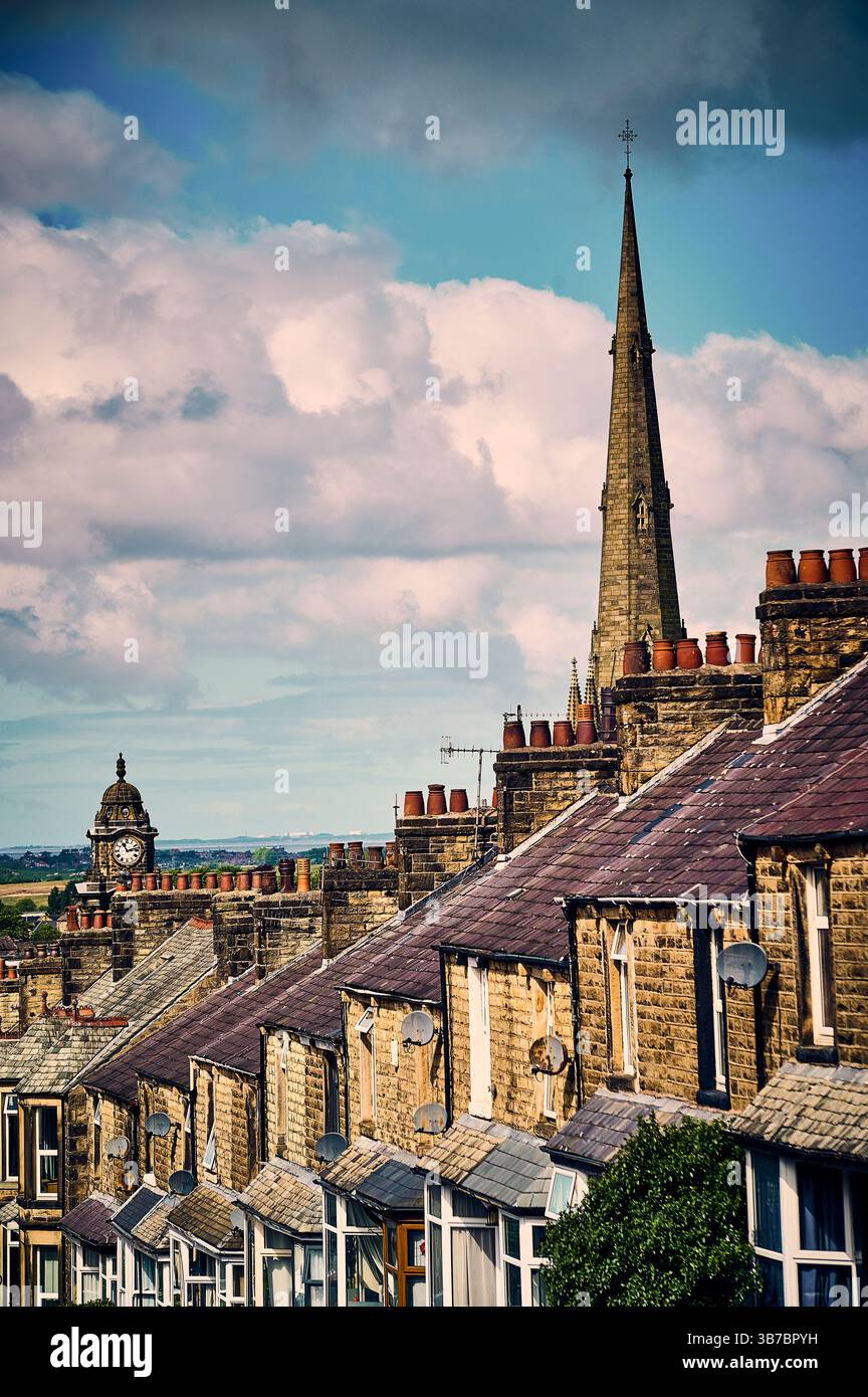 Spire of Lancaster cathedral over roofs of terrace houses in lancaster ...