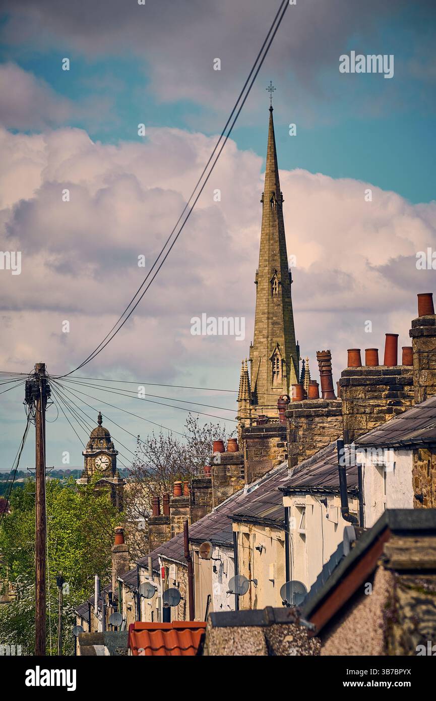 Spire of Lancaster cathedral over roofs of terrace houses in lancaster ...