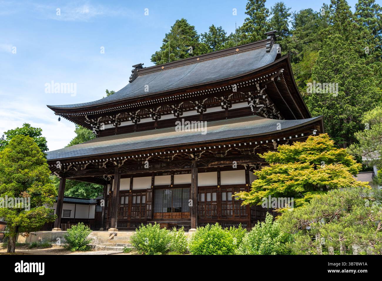 Traditional wooden structures and manicured gardens surround the main ...