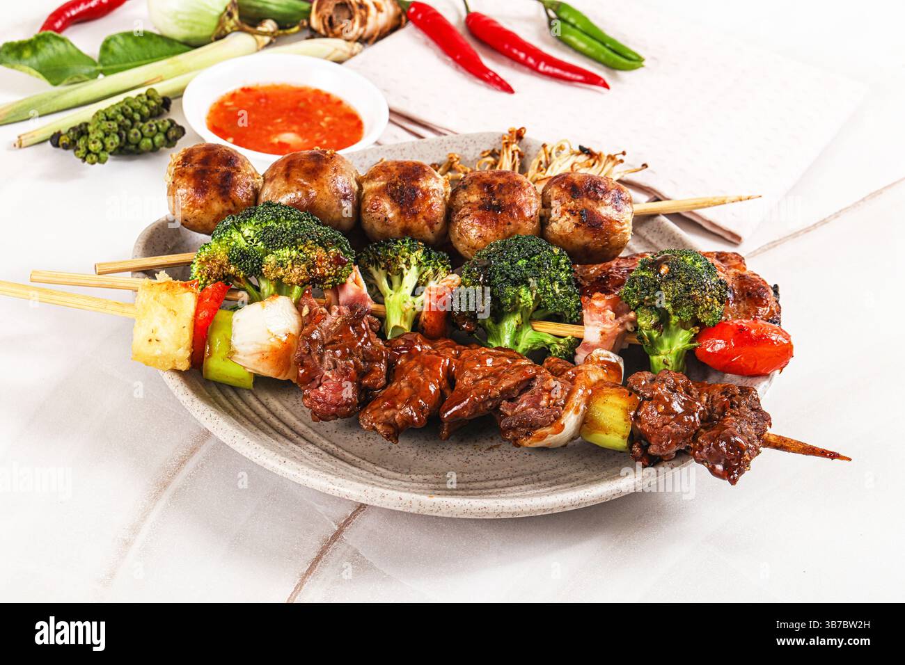 Asian grilled skewer assortment satay with beef, porl, chicken and ...