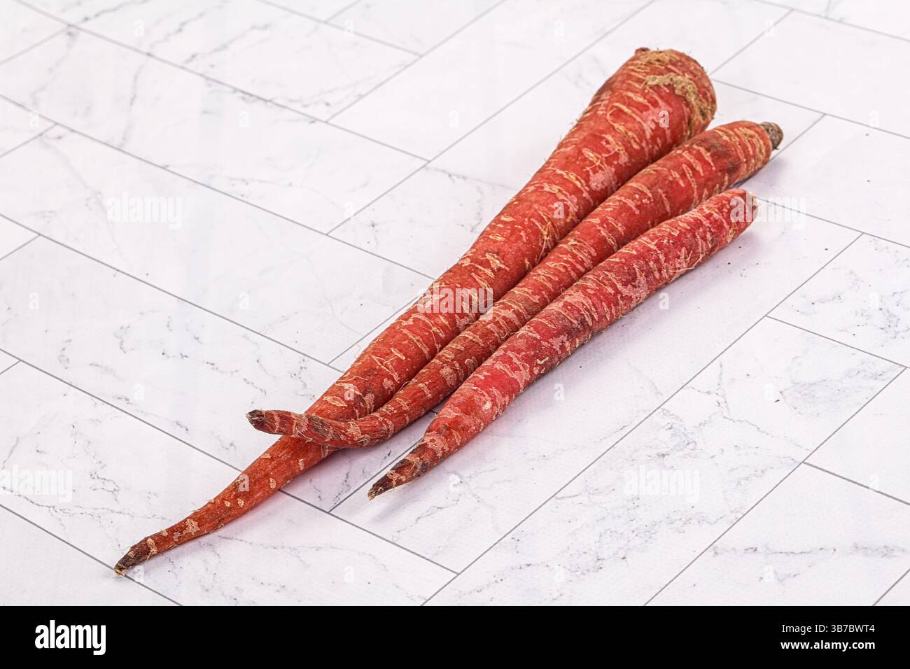 Red Indian raw carrot vegetable root Stock Photo - Alamy