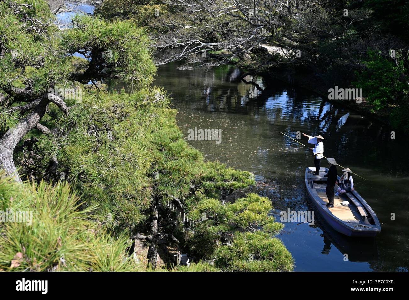 Boatman of Yanagawa, who punt traditional boats known as donko-bune ...