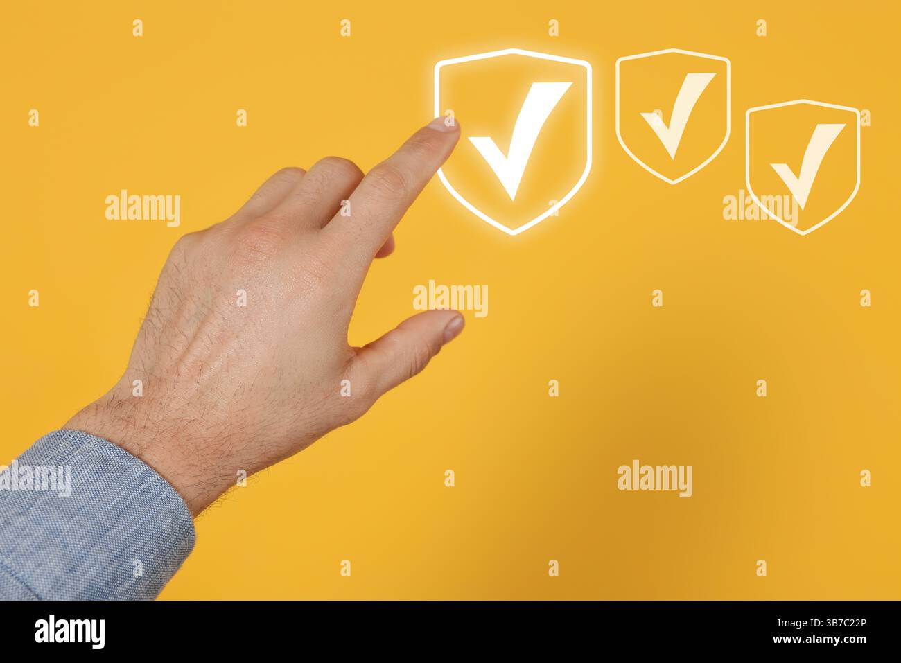 Approved. Man touching check mark on virtual screen against orange ...