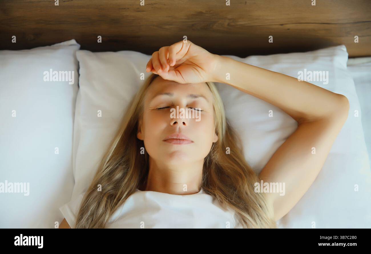 Exhausted tired woman touching head, suffering from headache, stress ...