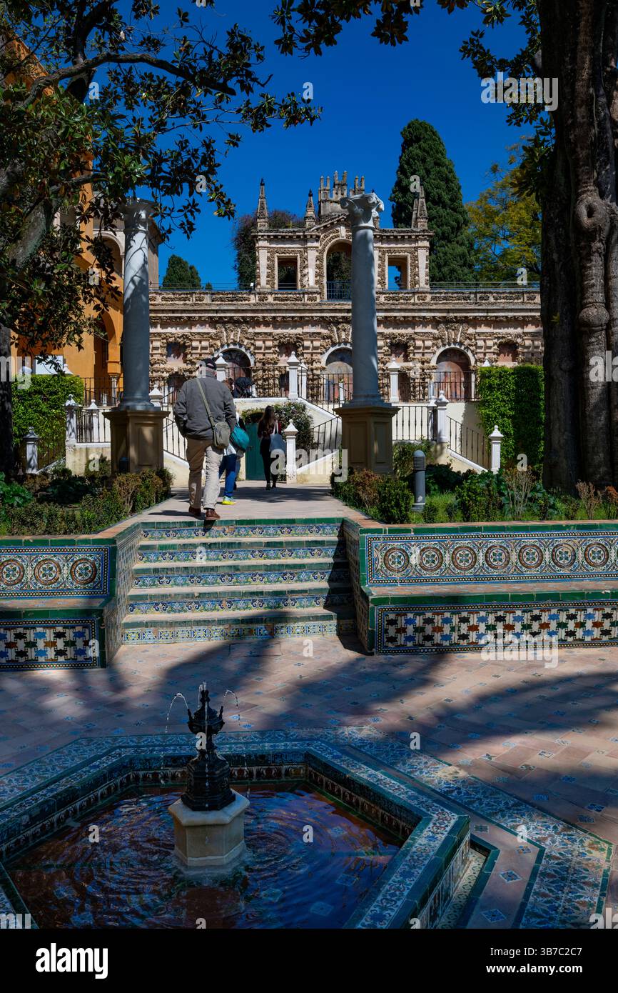 The Gardens of the royal palace of Real Alcazar, Seville Spain. Tall ...