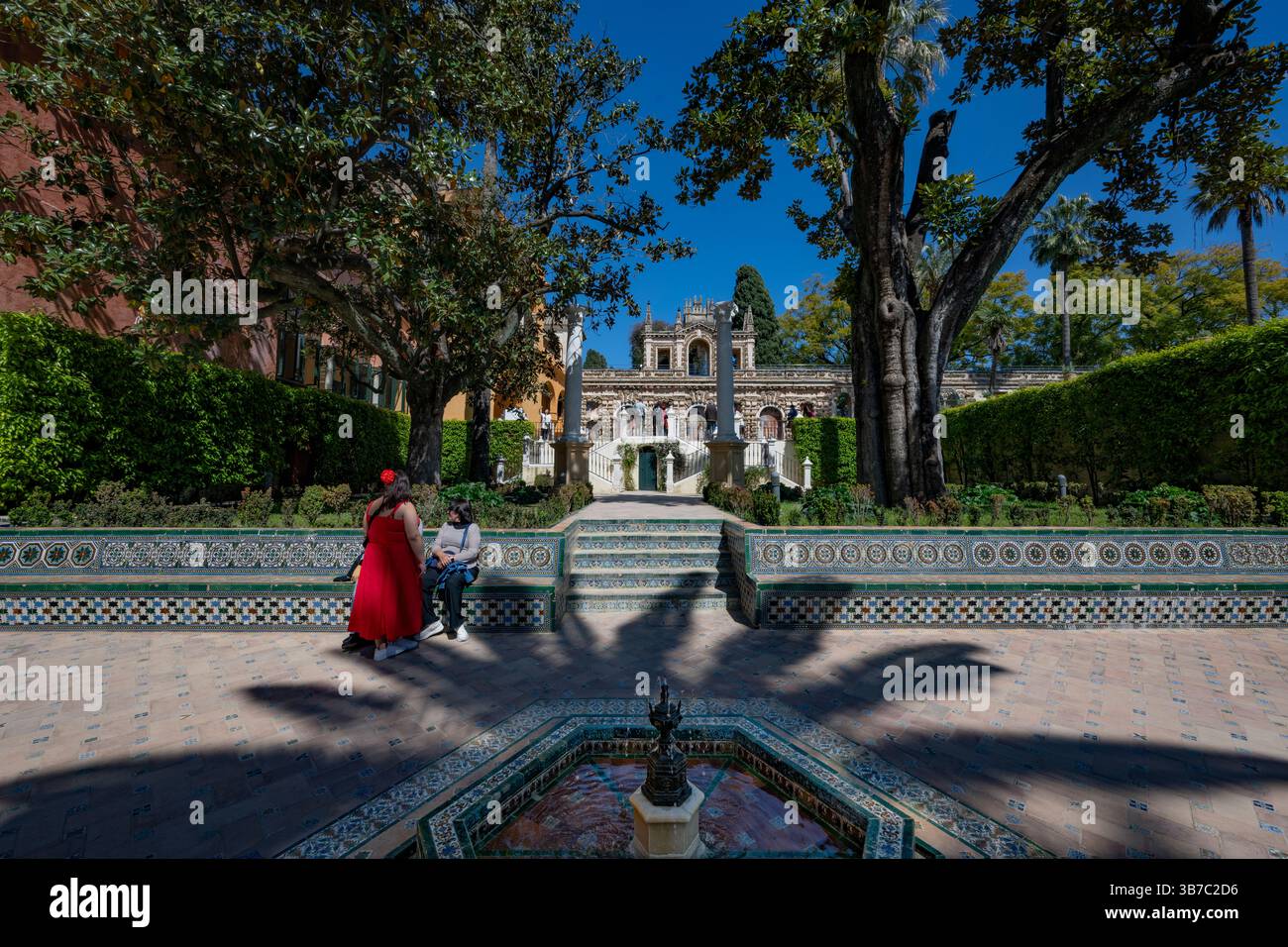 The Gardens of the royal palace of Real Alcazar, Seville Spain. Tall ...