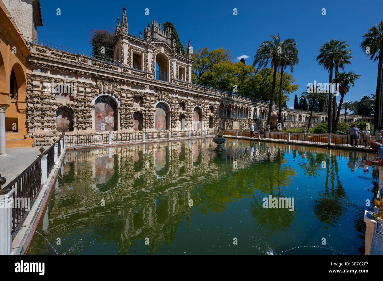 The Gardens of the royal palace of Real Alcazar, Seville Spain. Tall ...
