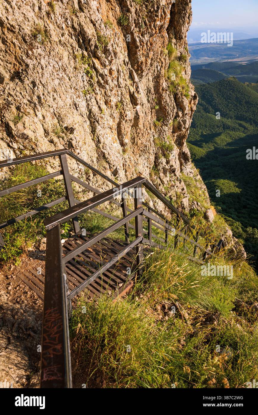 Narrow hiking staircase descending a steep mountain ridge with scenic ...