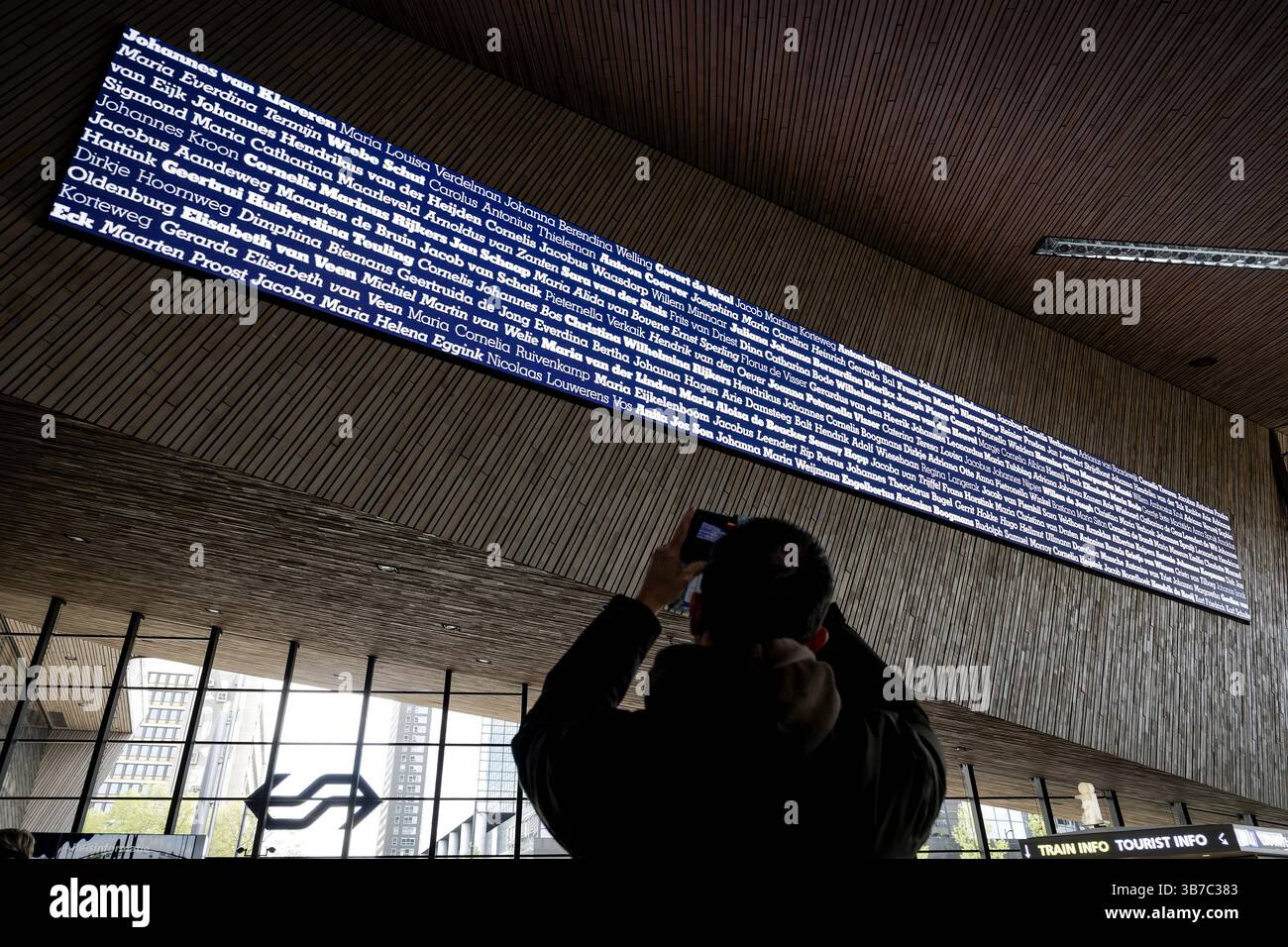 ROTTERDAM - A projection of names and, where possible, faces of victims ...