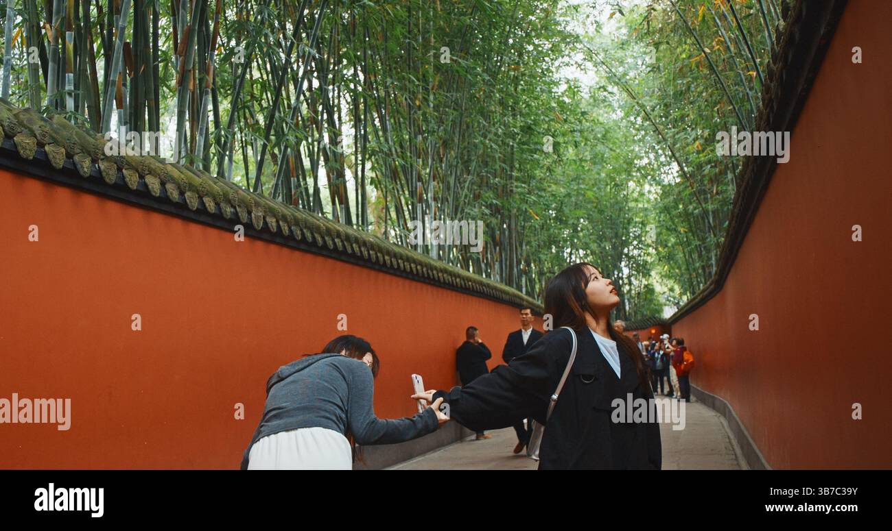 Chengdu, Sichuan, China. Two Pretty Girl Tourists Smile At Cam. Girls ...