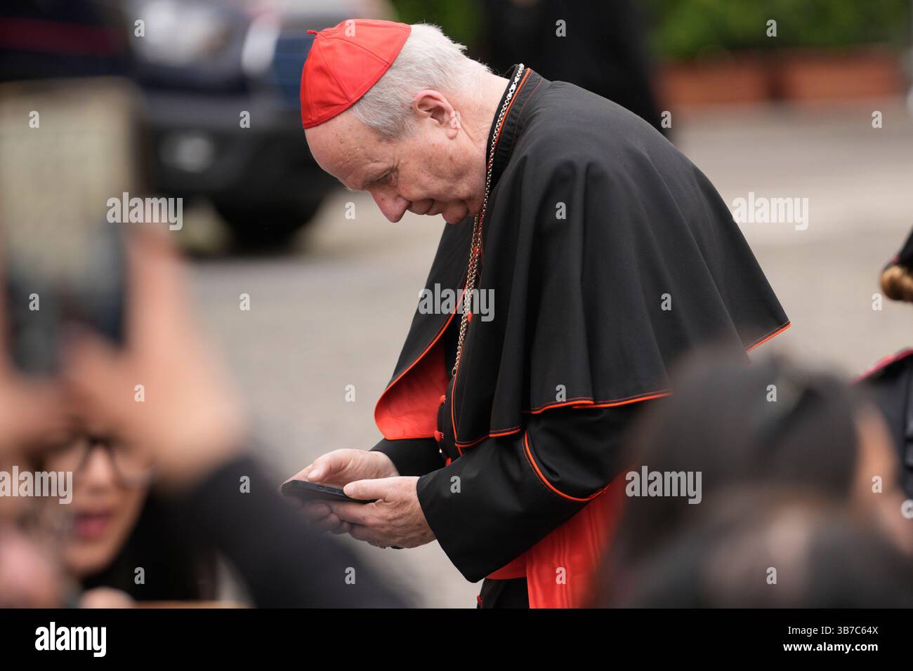 Rome, Italy. 27th Apr, 2025. Cardinal Christoph Schonborn is seen using ...
