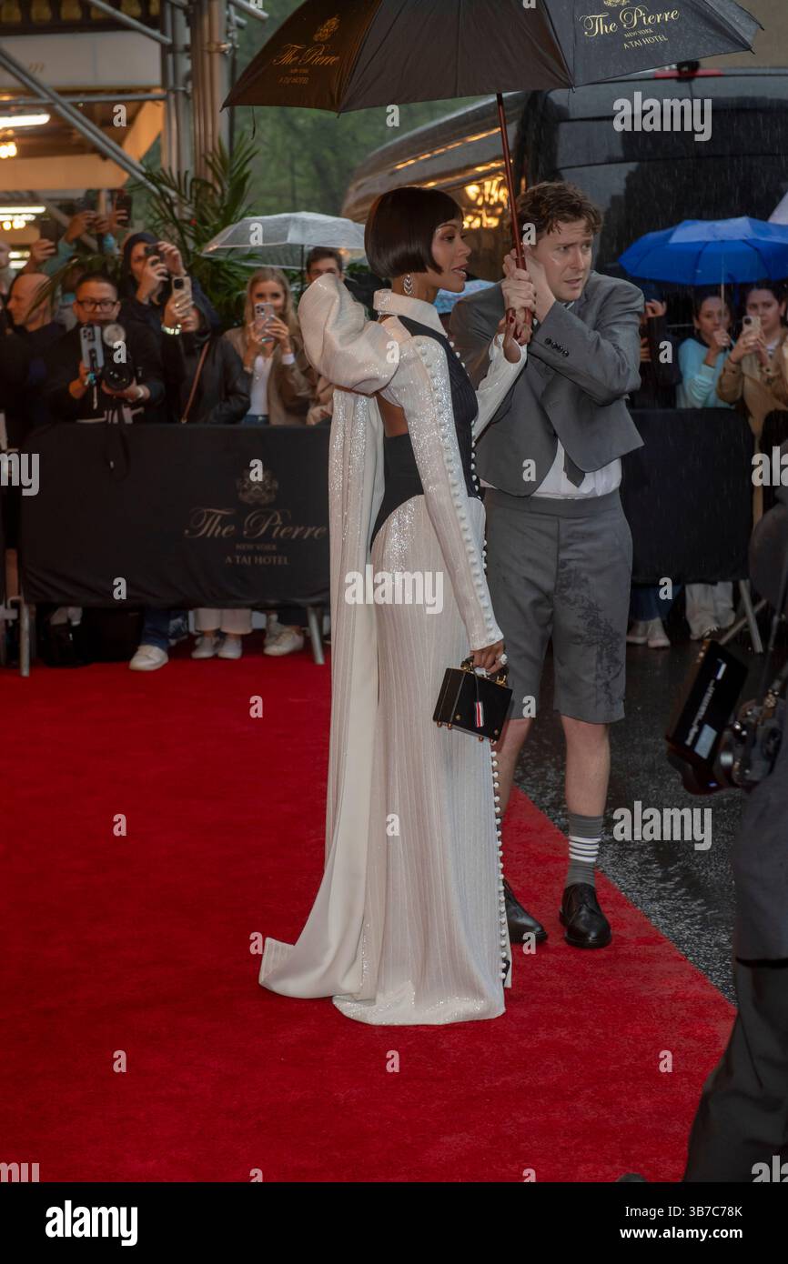 Zoe Saldaña wearing Thom Brown departs the Pierre Hotel for 2025 Met ...