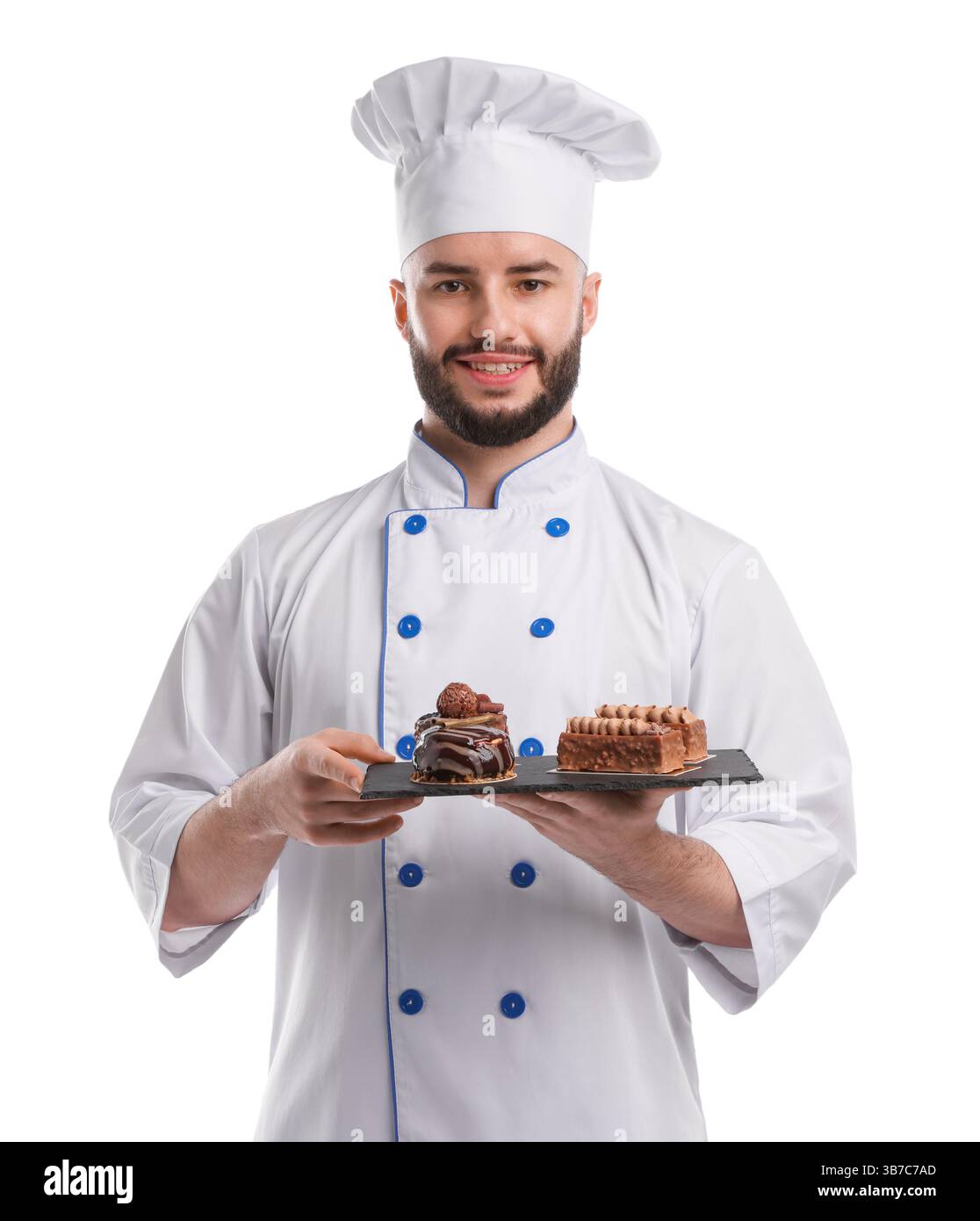 Happy confectioner in uniform holding delicious chocolate desserts on ...