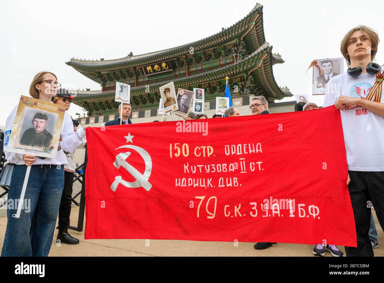 Russians march with a Soviet victory banner during the Immortal Regiment (Bessmertny polk) march ...