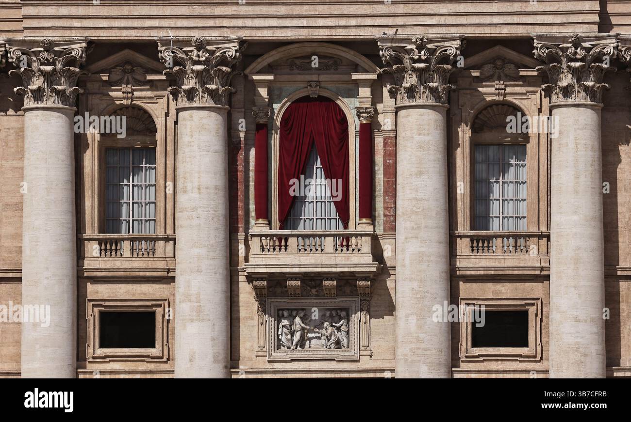 May 6, 2025 - Vatican City. Red drapes are wrapped around columns of ...