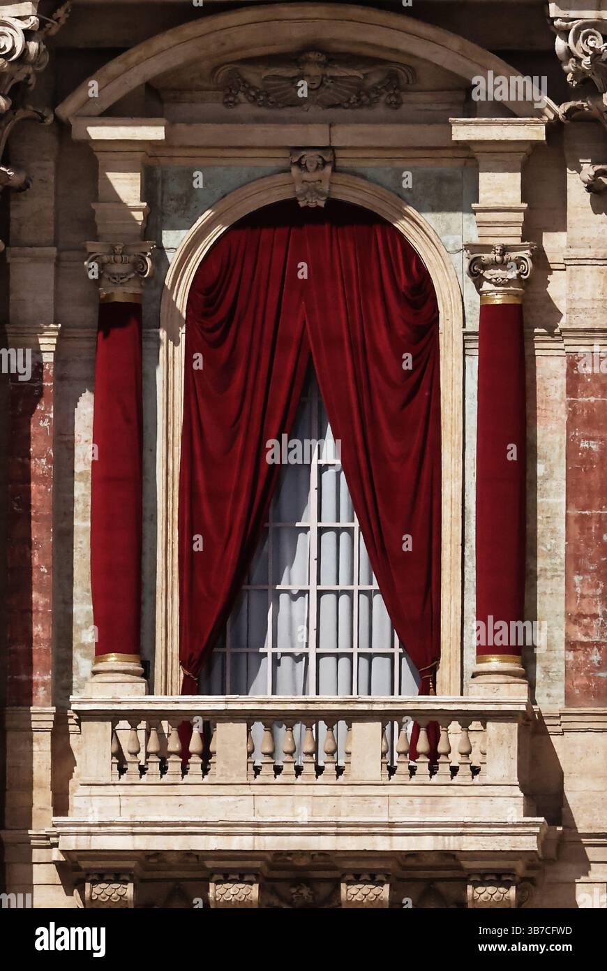 May 6, 2025 - Vatican City. Red drapes are wrapped around columns of ...