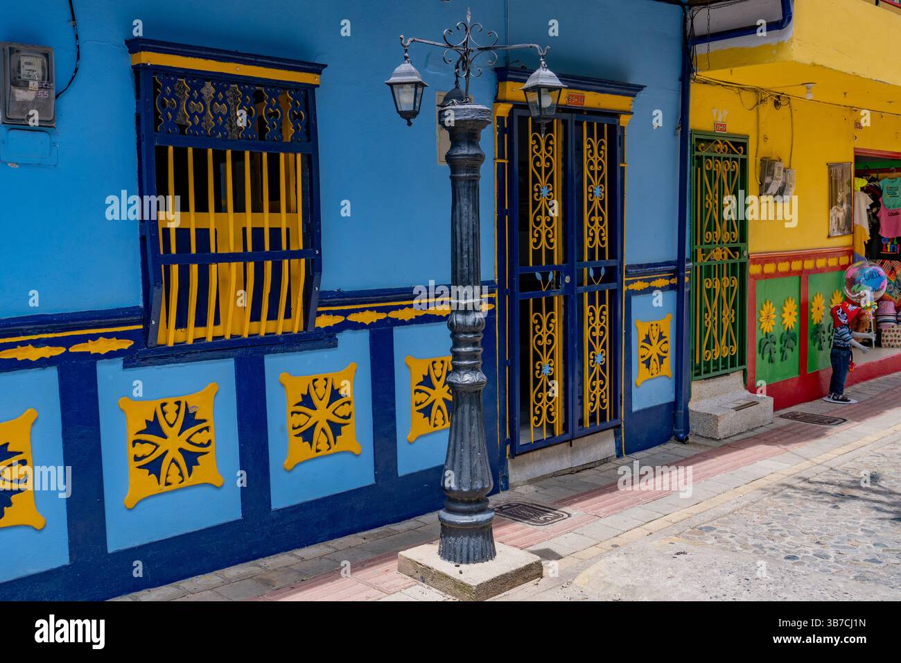 Colorfully-painted woodwork & a 3-D plaster mural or zócalo on the wall ...
