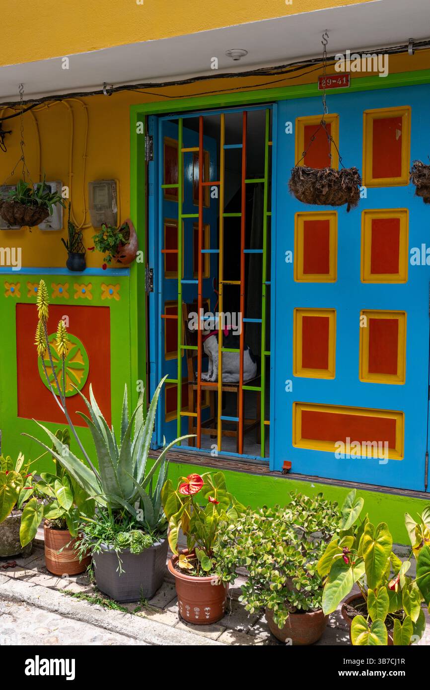 Colorfully-painted woodwork & a 3-D plaster mural or zócalo on the wall ...