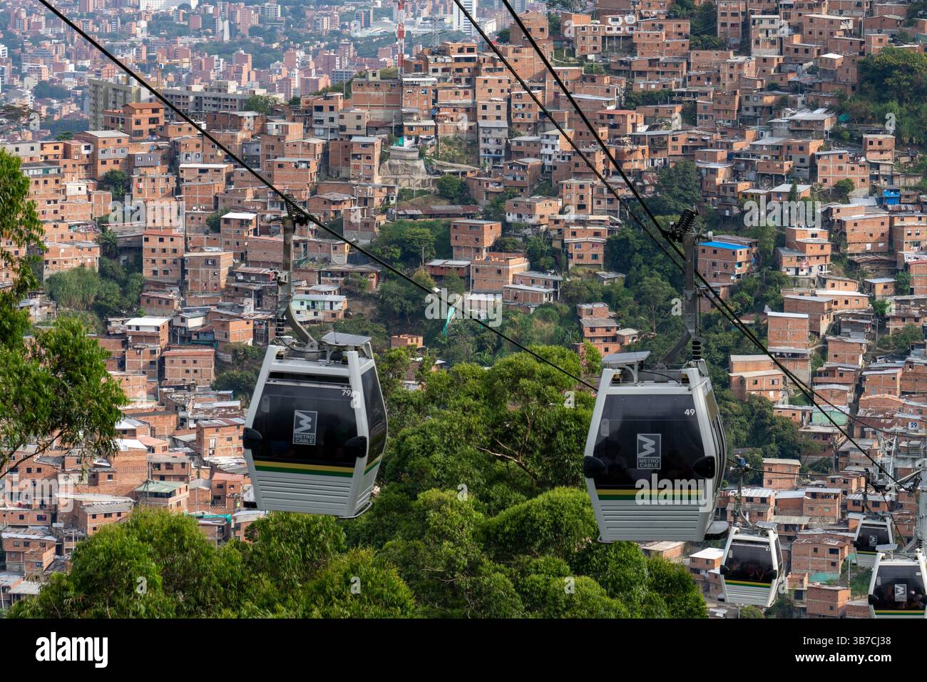 Gondolas of the Medellin Metrocable system serving the lower income ...