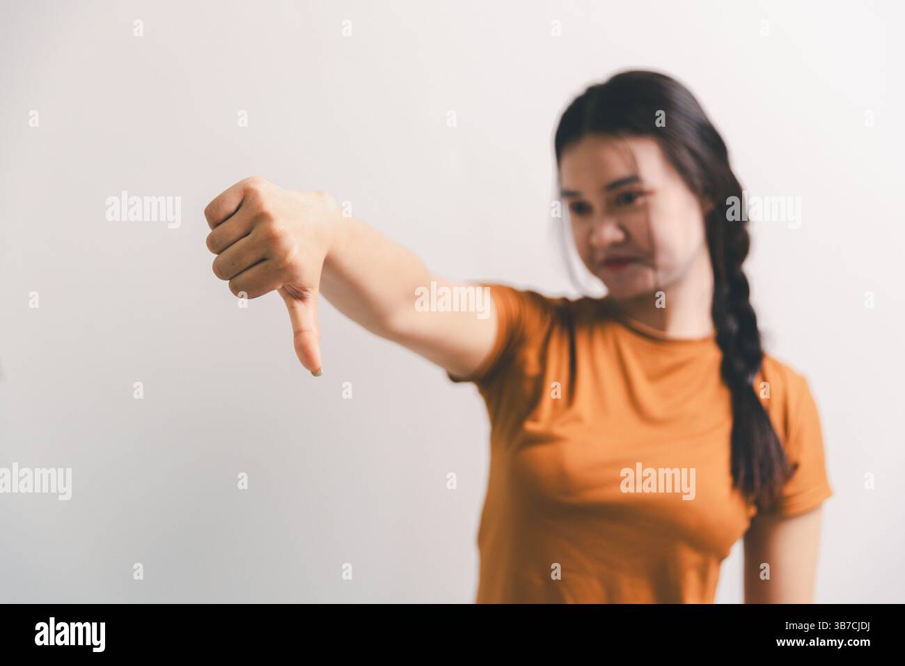 Asian girl expresses dislike, person express negative feeling, concept ...