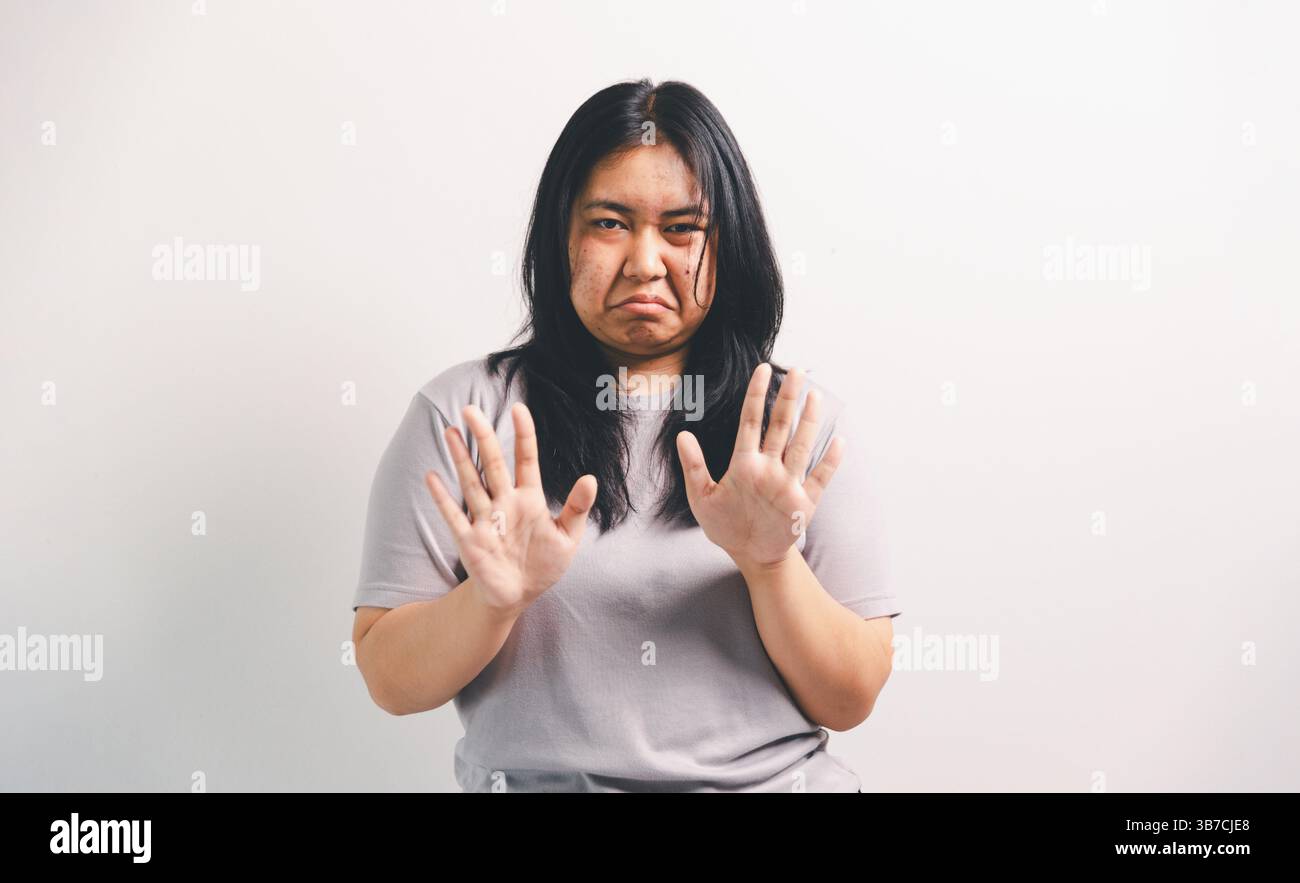 Asian girl expresses dislike, person express negative feeling, concept ...