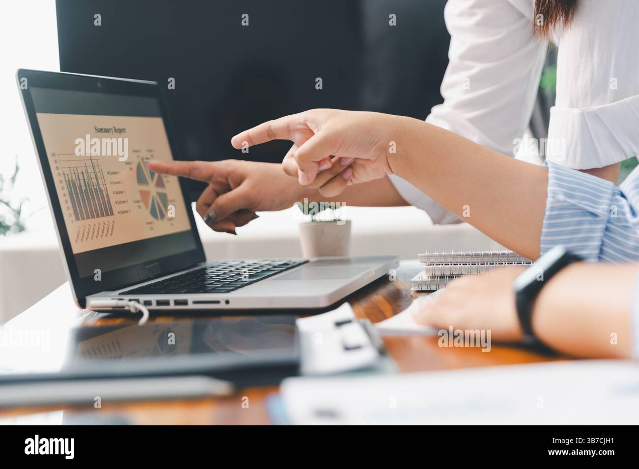 Teamwork with business people analysis cost graph on desk at meeting ...