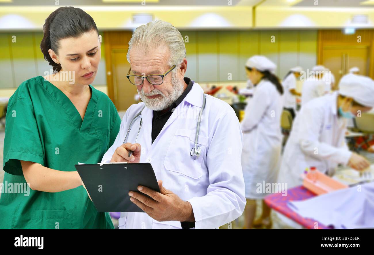 Doctor and nurse receiving blood donation in hospital Stock Photo - Alamy