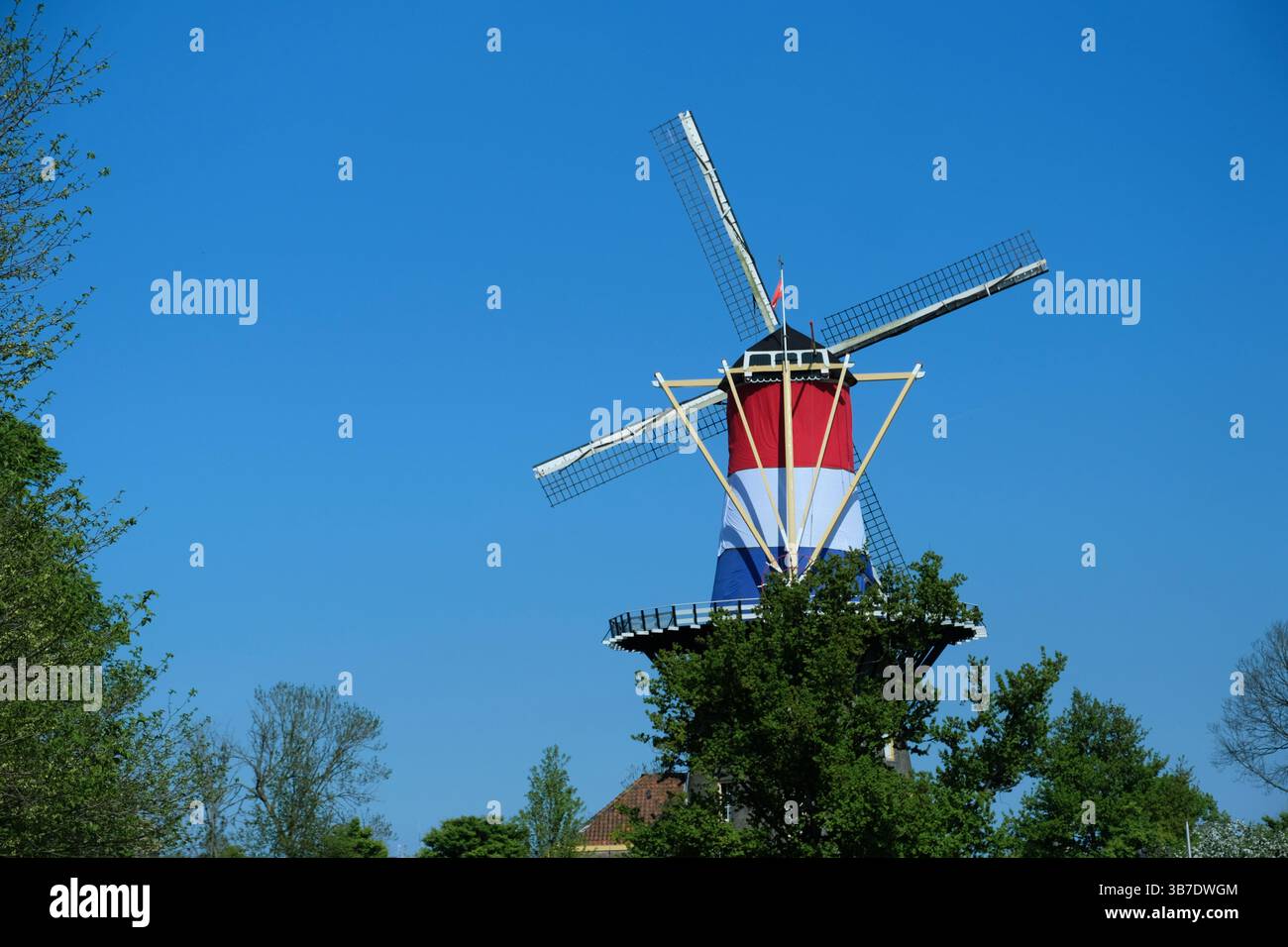 De Valk Windmill Museum is wrapped in Dutch national flag during the ...