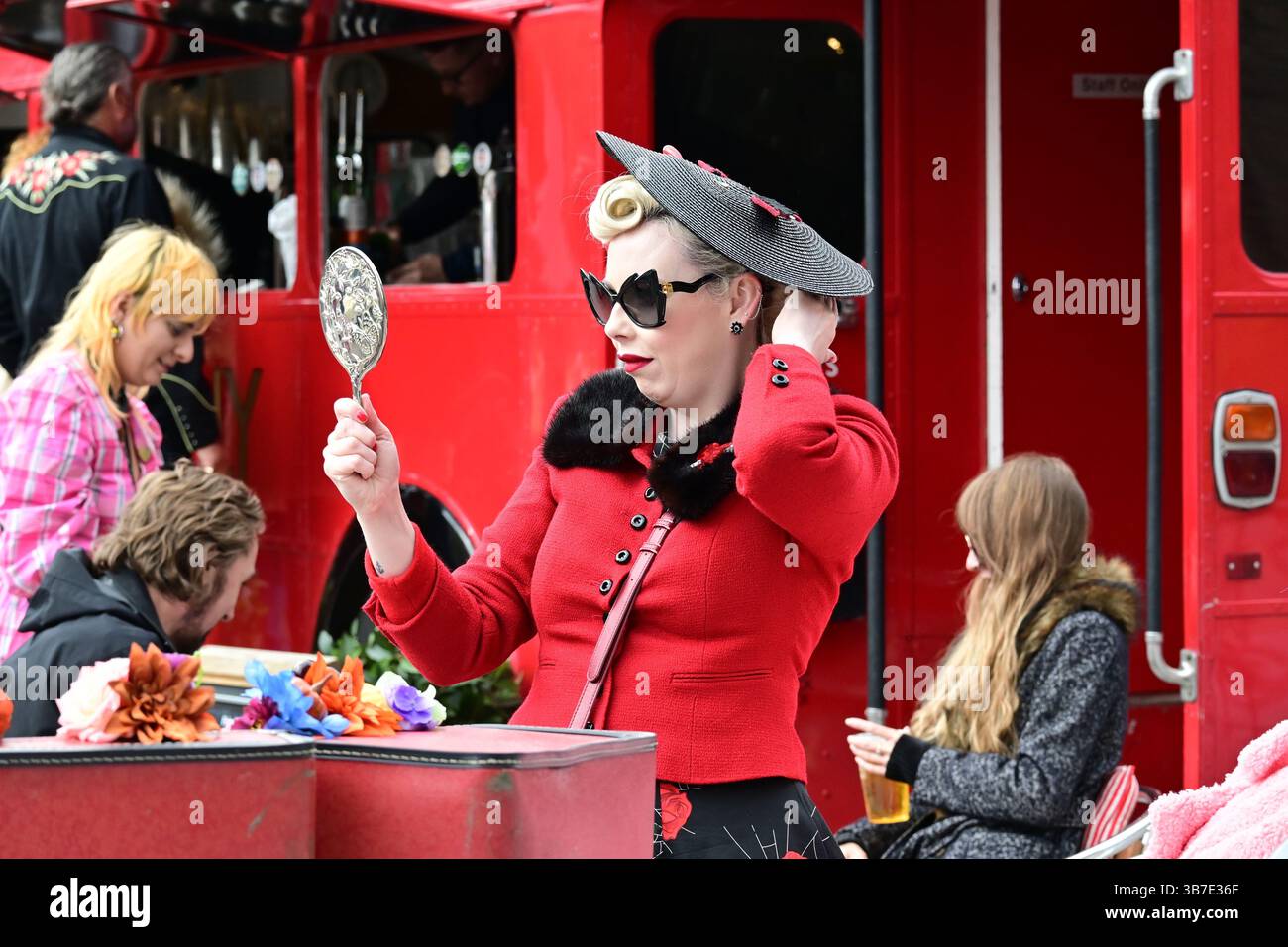 Lady Trying on a a hat at The Classic Car Boot Sale, Kings Cross ...