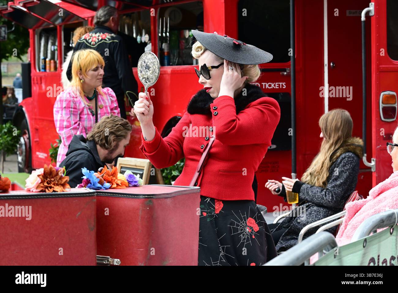 Lady Trying on a a hat at The Classic Car Boot Sale, Kings Cross ...