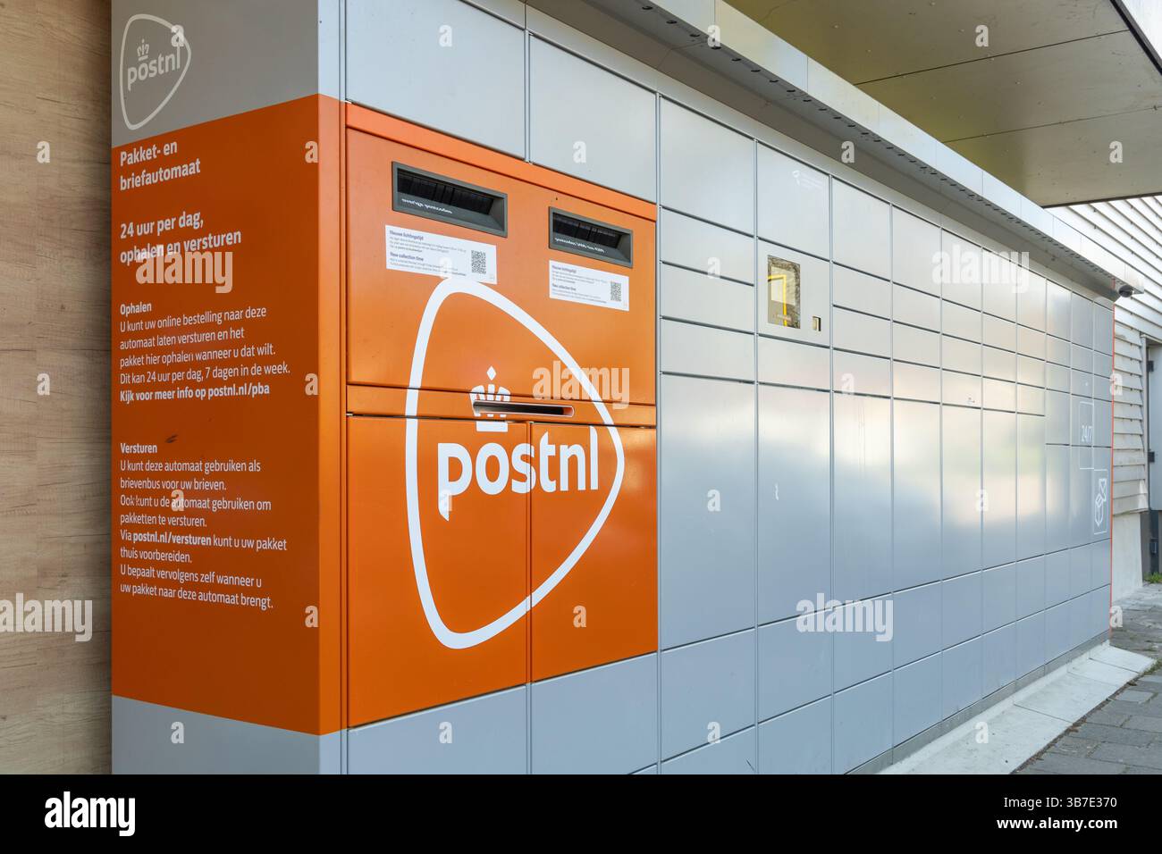 An orange and grey PostNL parcel and letter locker in the Netherlands ...
