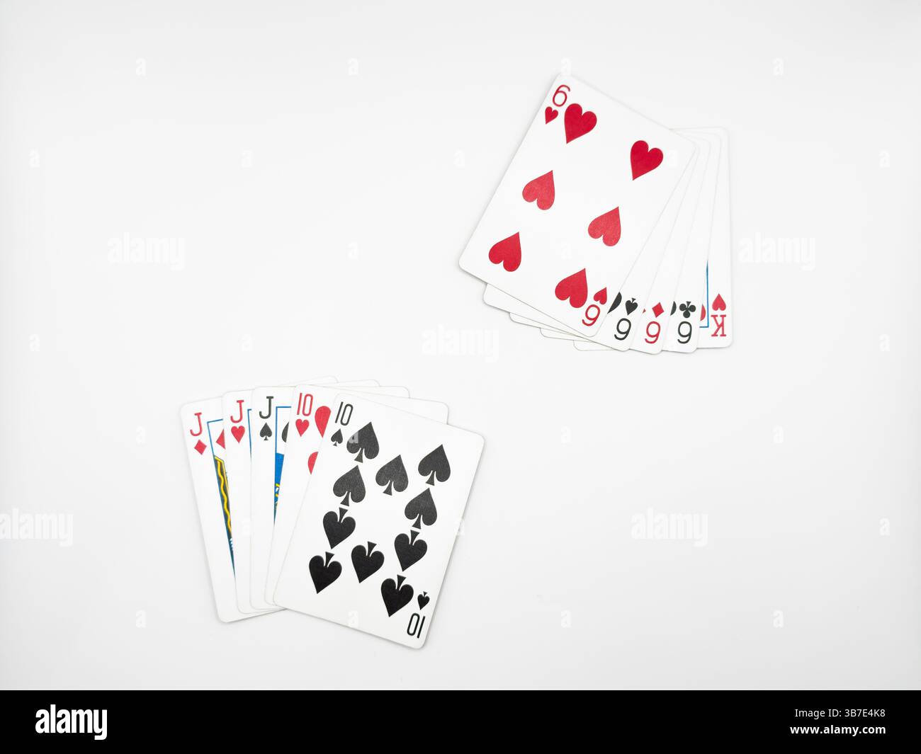 White plastic poker cards full house hit opponent on white background ...