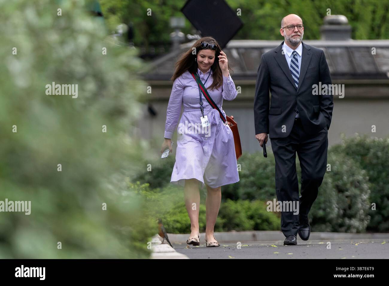 Office of Management and Budget director Russell Vought walks after a ...