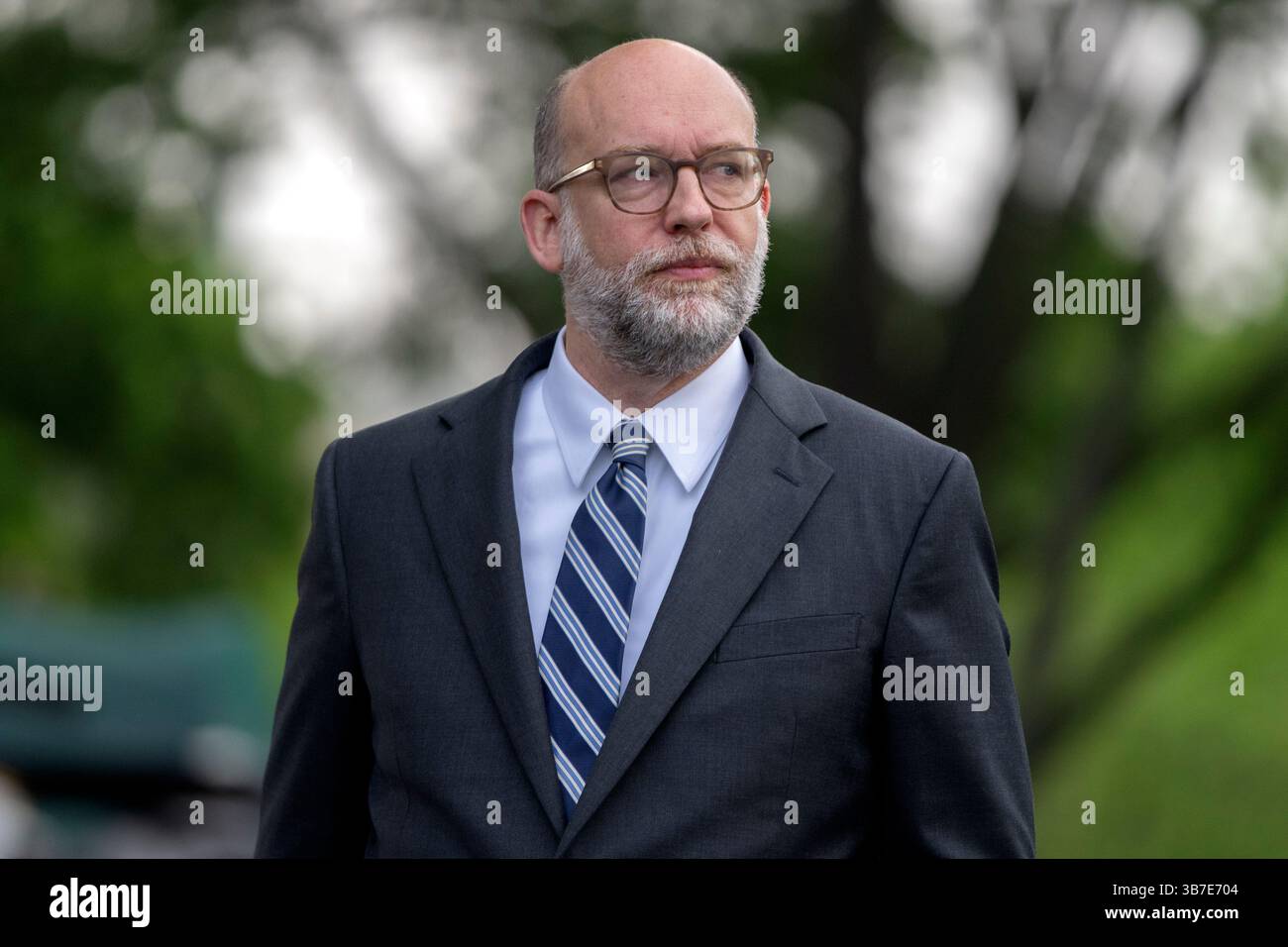 Office of Management and Budget director Russell Vought walks after a ...