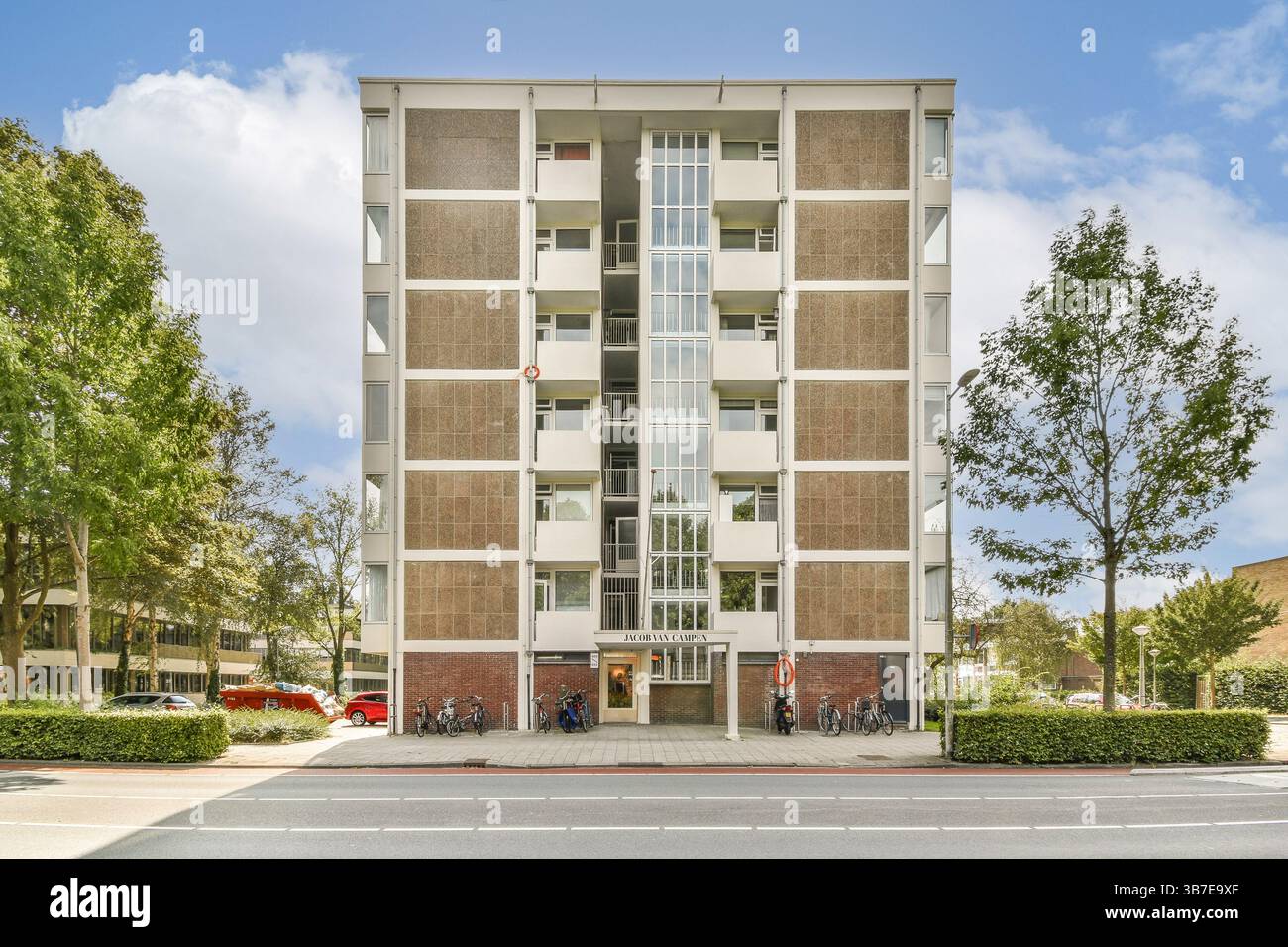 A striking modern building stands tall in an urban environment, flanked ...