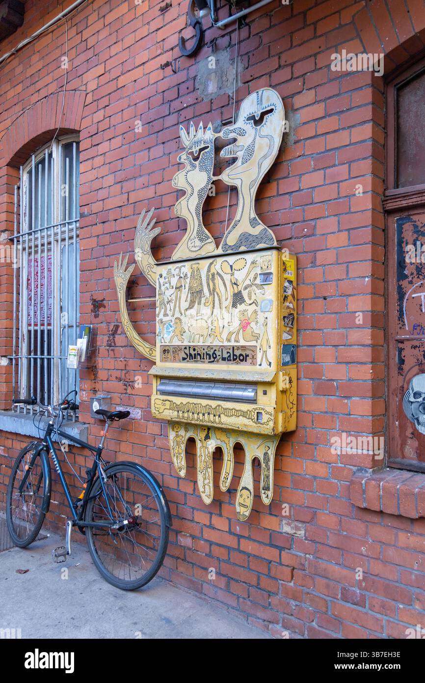 Colorful urban art installation on a brick wall featuring abstract ...