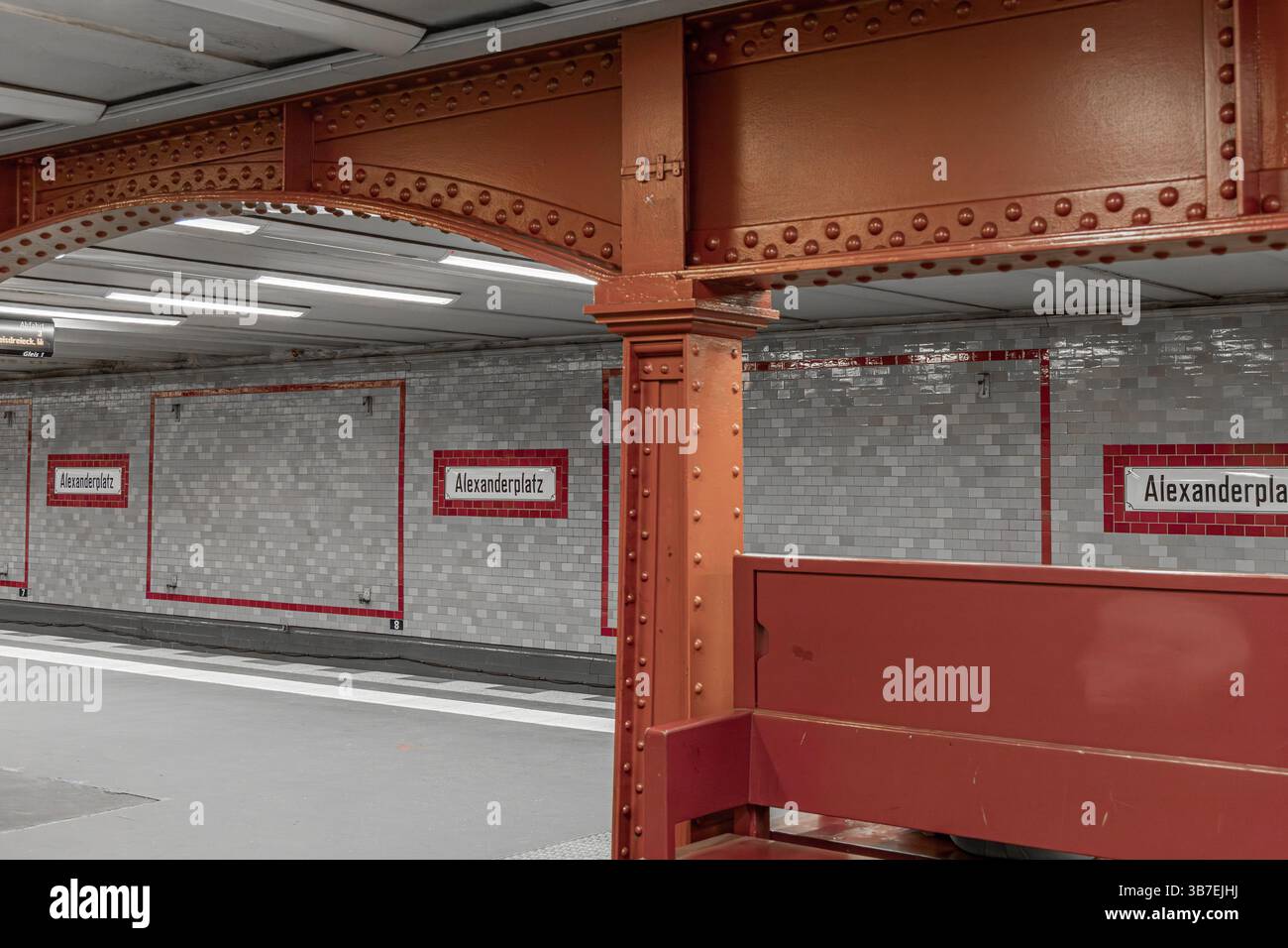 Interior view of Alexanderplatz U-Bahn station in Berlin with red iron ...