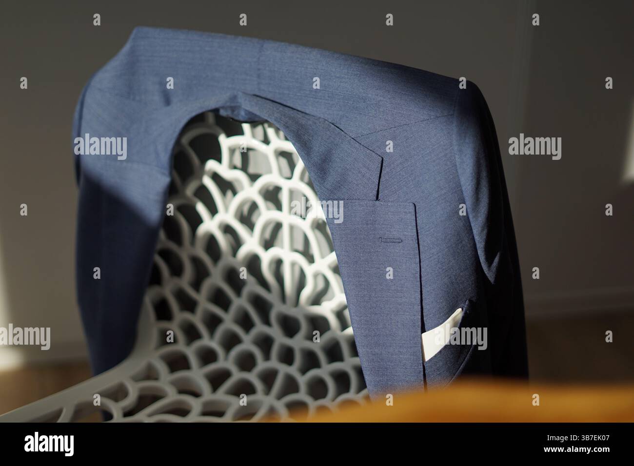 Navy Suit Corporate Blazer Draped Over Chair in Modern Office Setting ...