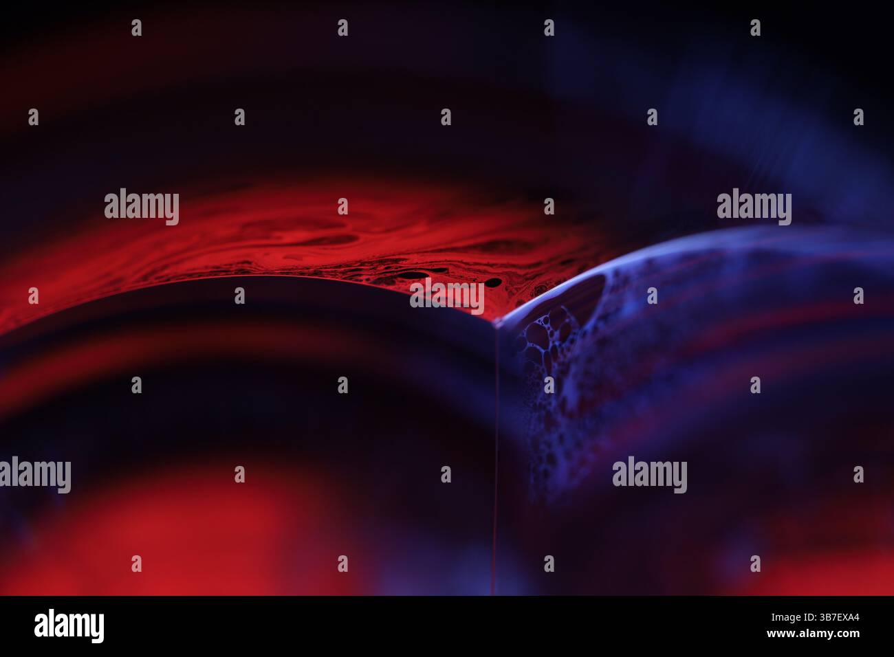 Red reflections of liquid in macro, red liquid surface, bubbles in ...